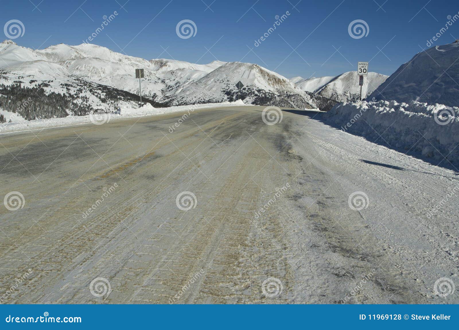 Snow packed mountain road stock photo. Image of winter - 11969128