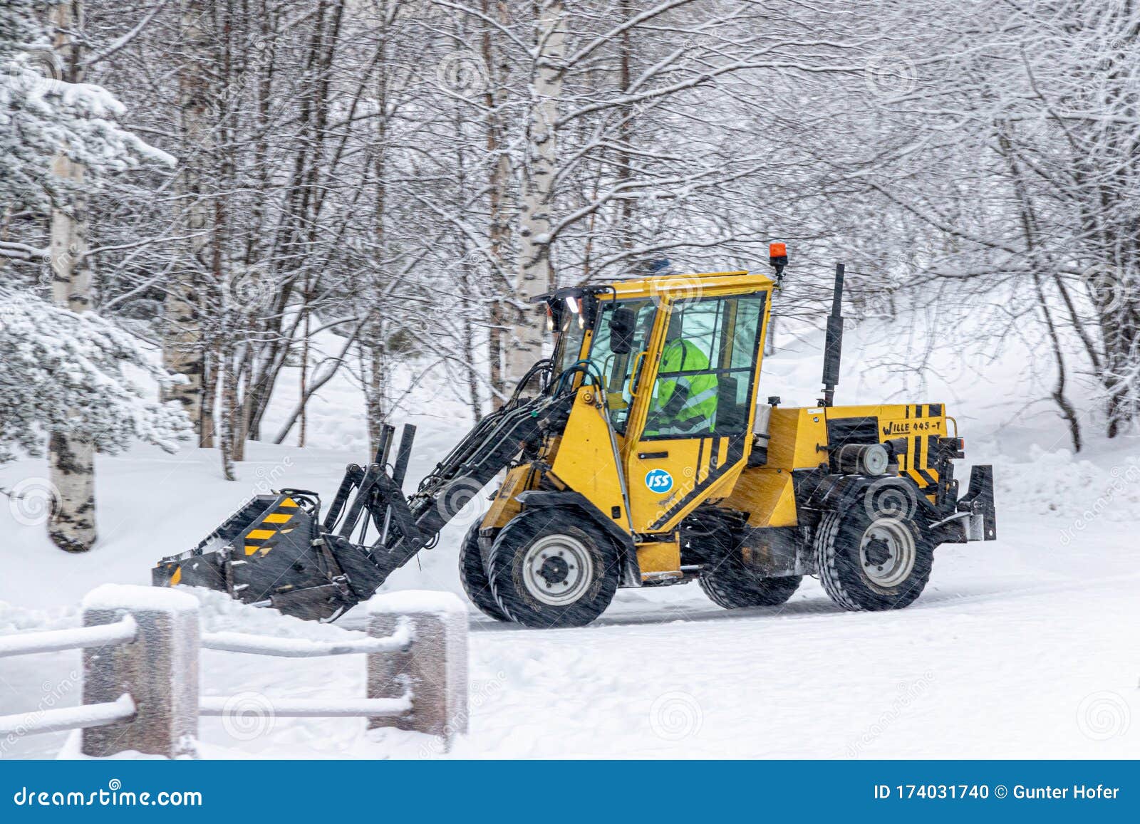 Snow Plow Tractor Breaks And Removes Ice From A City Street After A ...