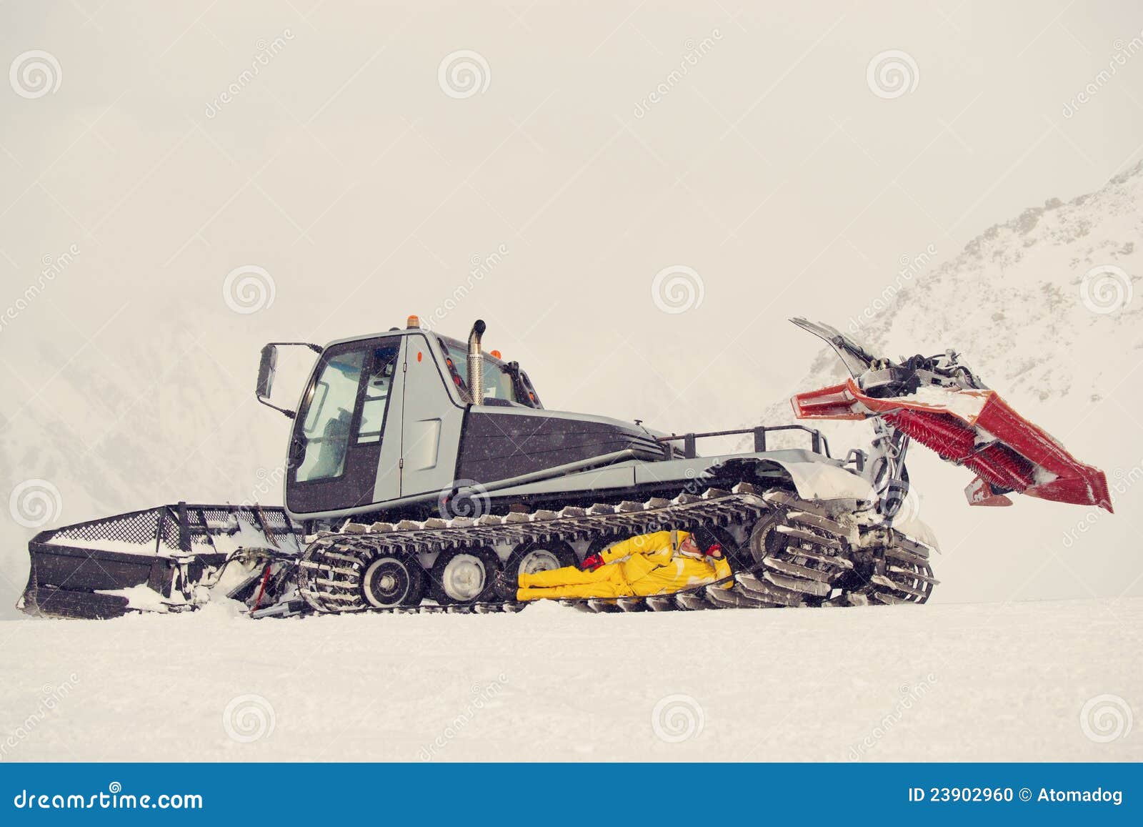 Snow Plow with a Man in Its Track Chain Stock Photo - Image of male ...