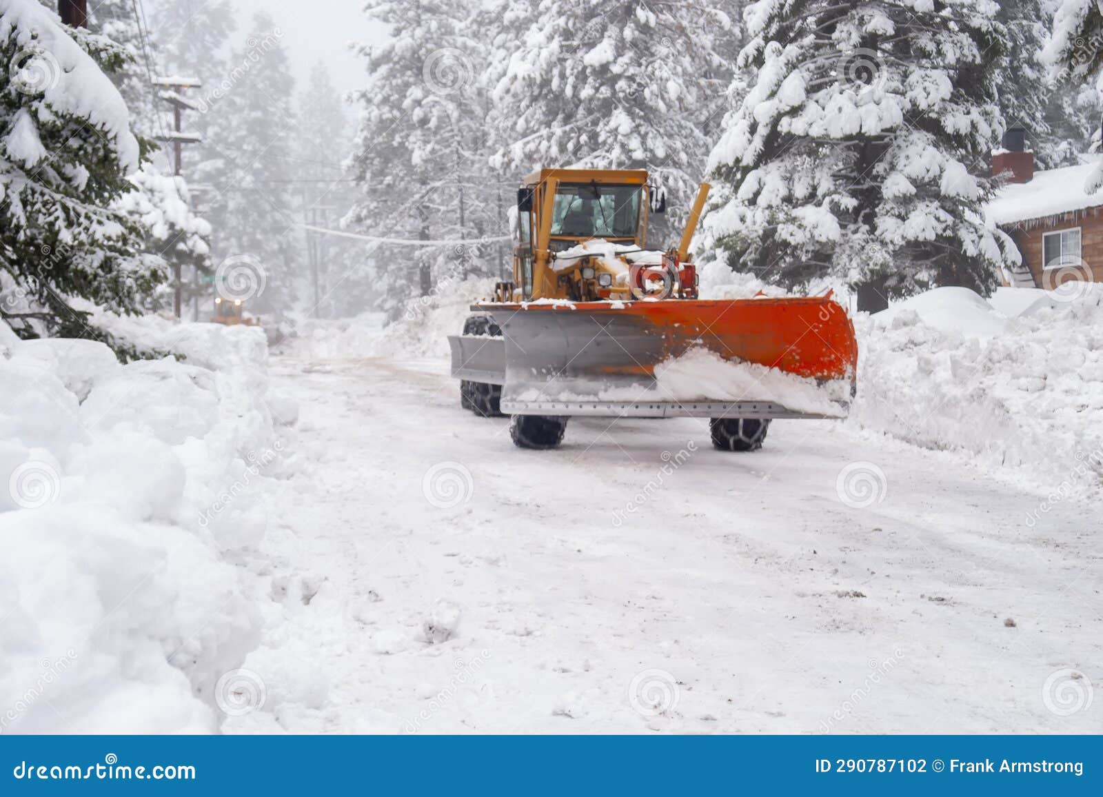 Snow Plow Tractor Working in Blizzard Conditions on a Road Stock Photo ...