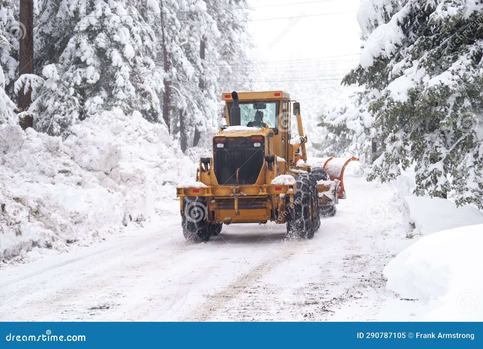 Snow Plow Tractor Working in Blizzard Conditions on a Road Stock Image ...
