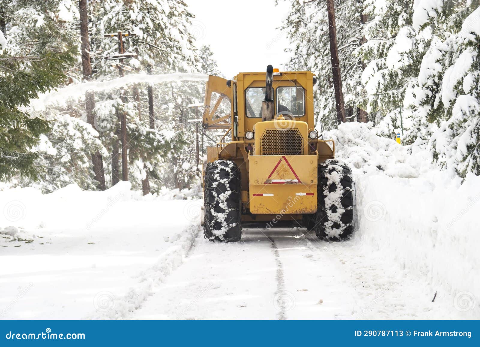 Snow Plow Tractor Working in Blizzard Conditions on a Road Stock Image ...