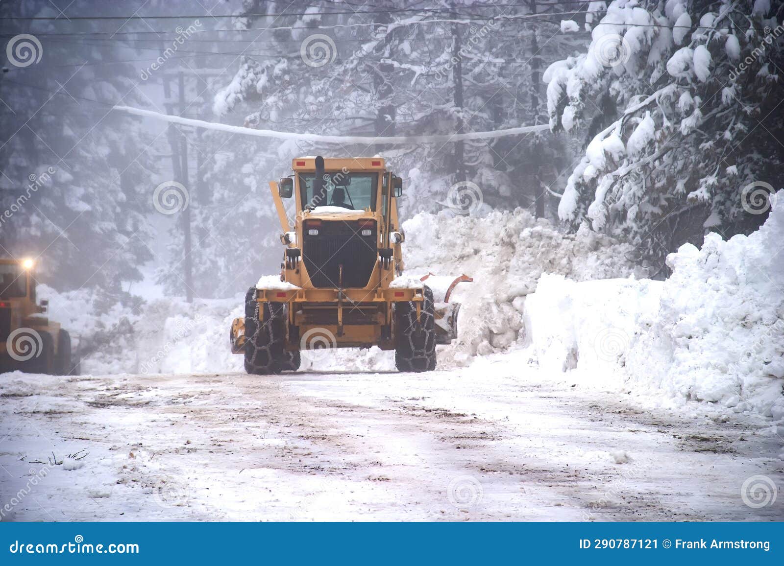 Snow Plow Tractor Working in Blizzard Conditions on a Road Stock Image ...