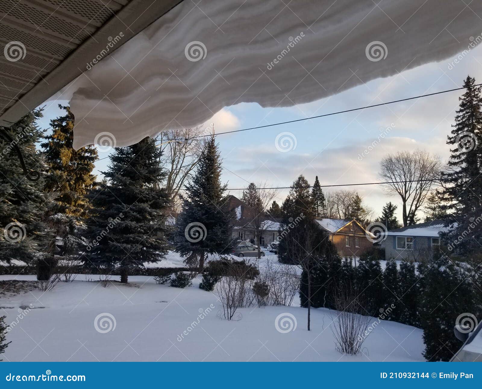 Snow Sliding off the Roof stock photo. Image of sliding - 210932144