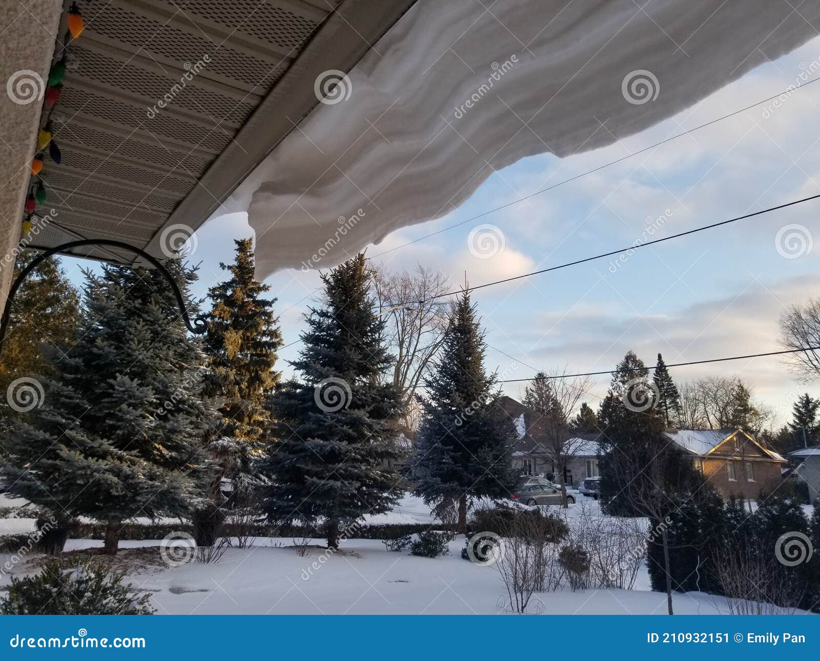 Snow Sliding off the Roof stock image. Image of house - 210932151