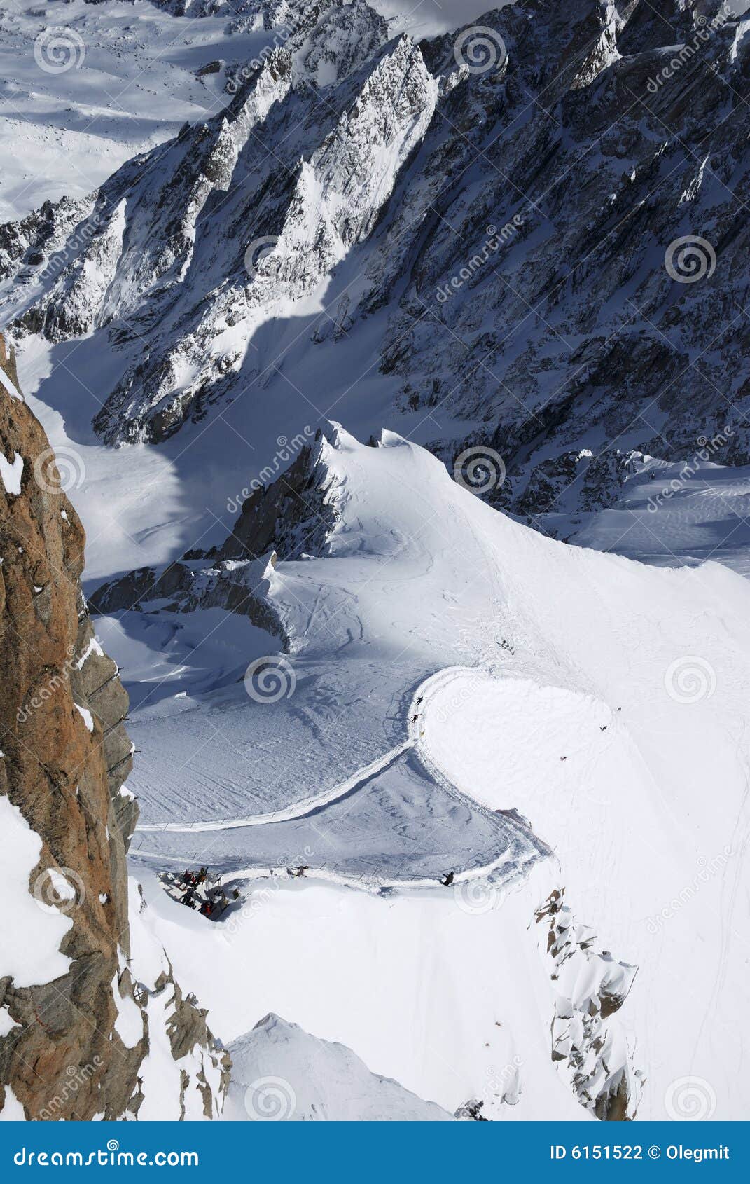 Snow Slope with Skiers between Mountain Ranges Stock Photo - Image of ...