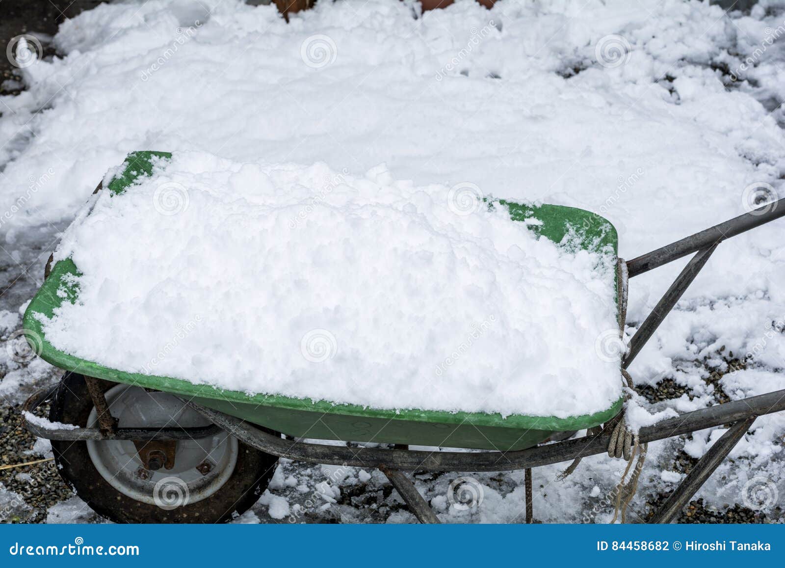 Snow on wheelbarrow stock photo. Image of snow, barrow - 84458682