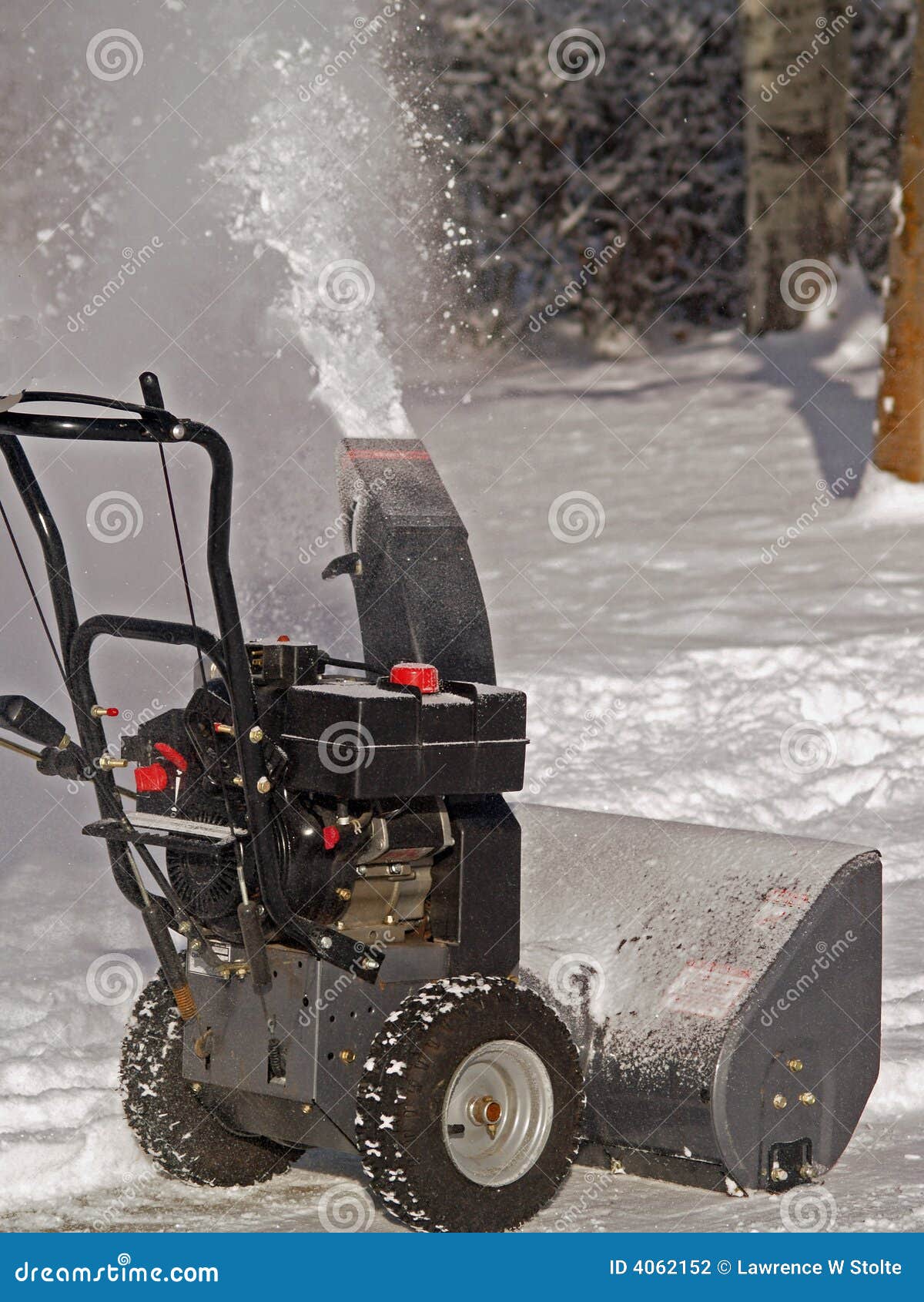 Snowblower in Action stock photo. Image of trunks, hedge - 4062152