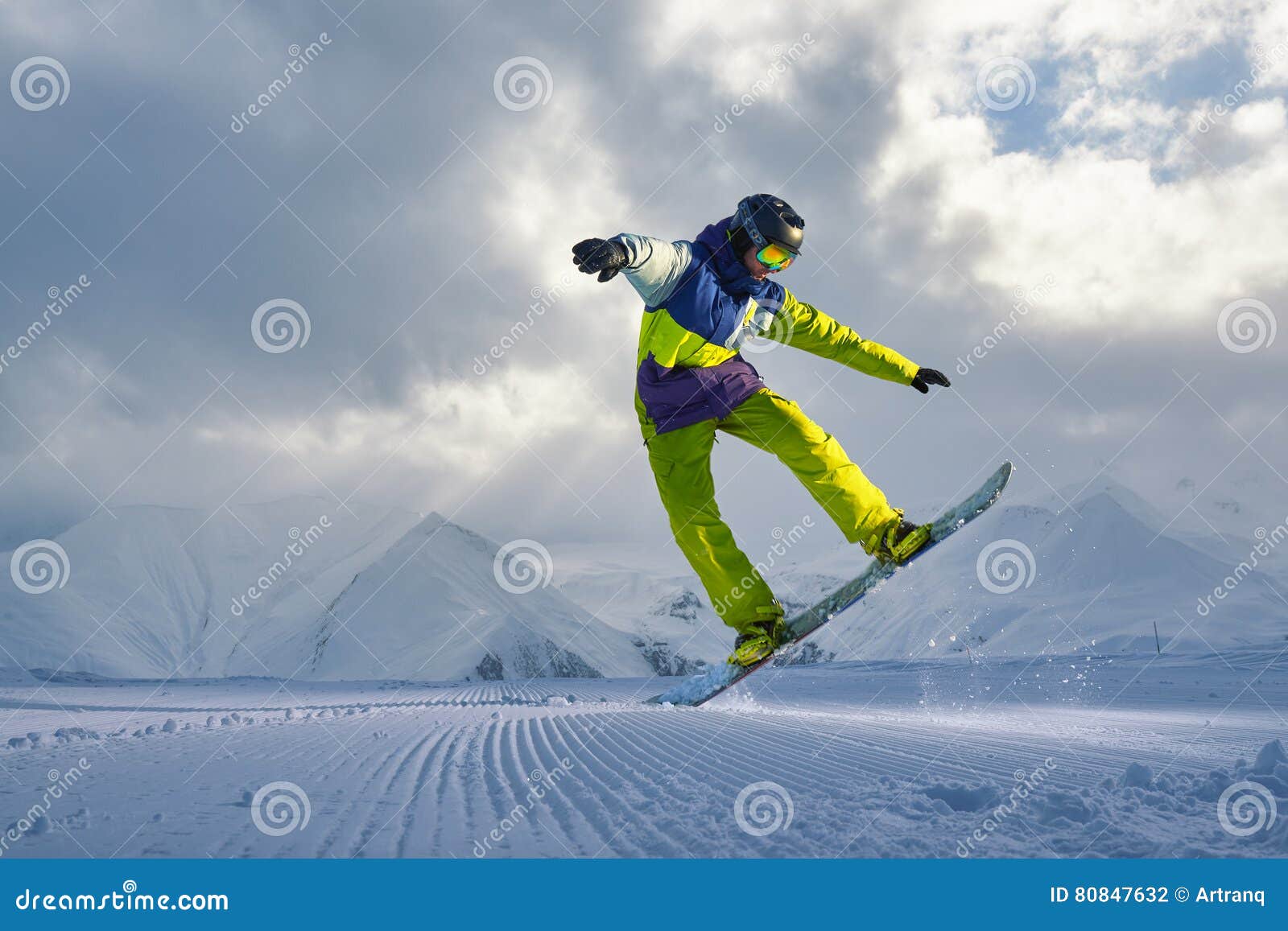 Snowboarder Does the Jumping Trick. Snow Scatters Pieces Stock Photo ...
