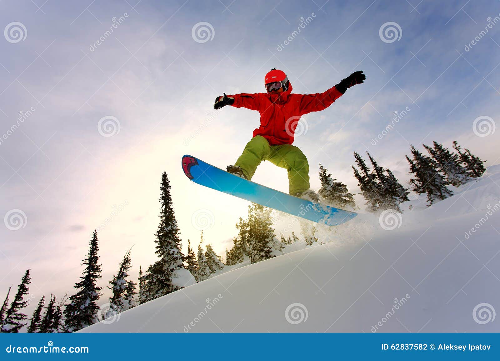 Snowboarder Doing a Toe Side Carve with Deep Blue Sky in Background ...