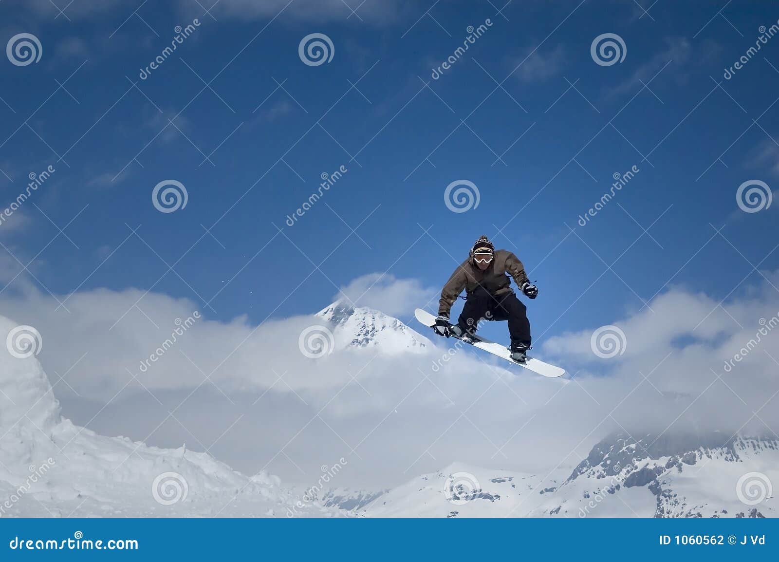 Snowboarder jumping stock photo. Image of blue, season - 1060562