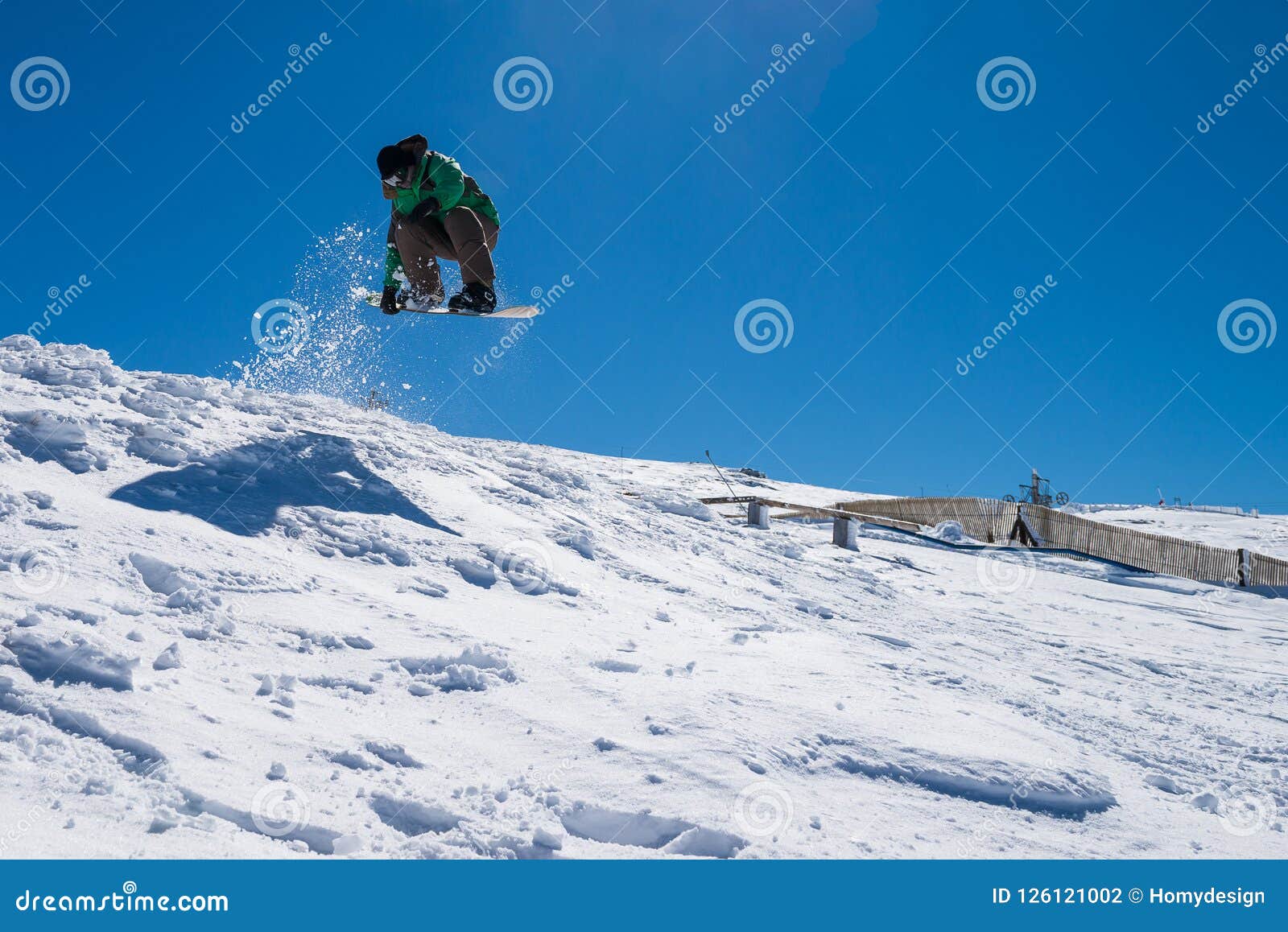 Snowboarder Jumping Against Blue Sky Stock Photo - Image of active ...