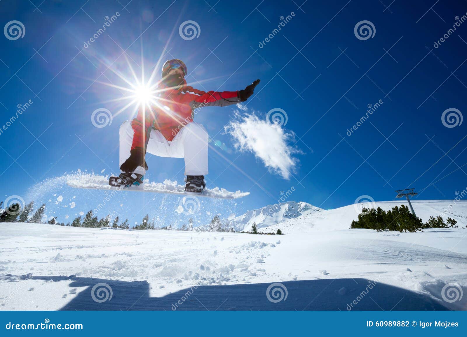 Snowboarder jumping in air stock photo. Image of action - 60989882