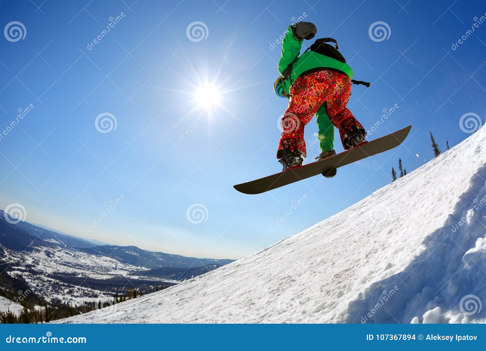 Snowboarder Jumping from the Springboard Against the Sky Stock Photo ...
