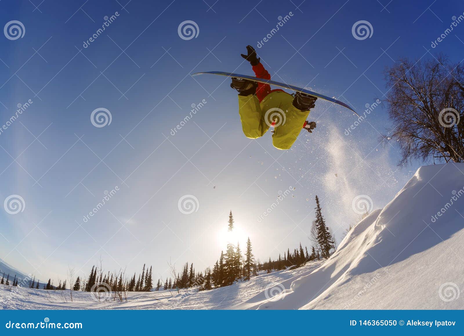 Snowboarder Jumping through Air with Deep Blue Sky in Background Stock ...