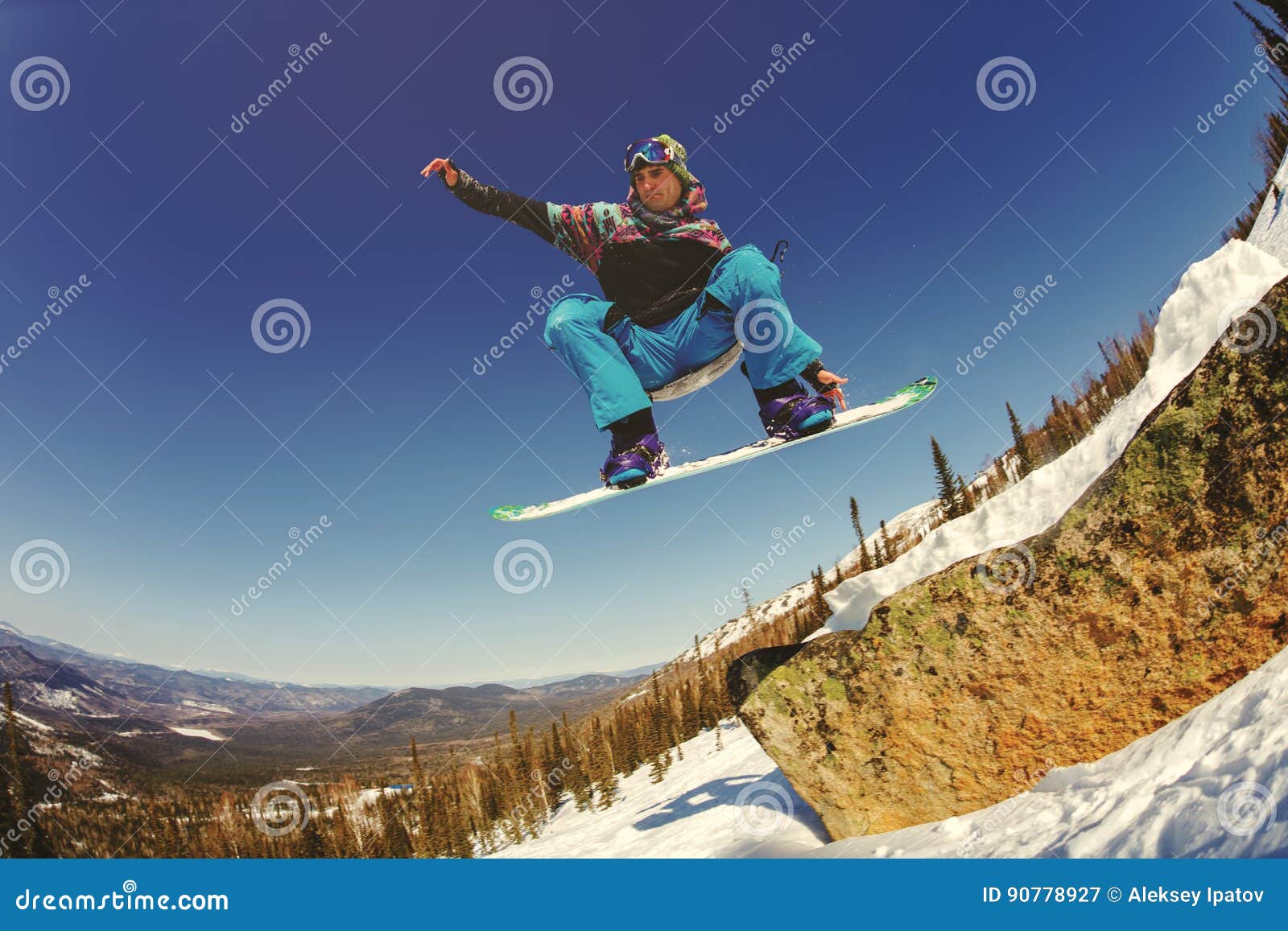 Snowboarder Jumping from the Springboard Against the Sky Stock Image ...