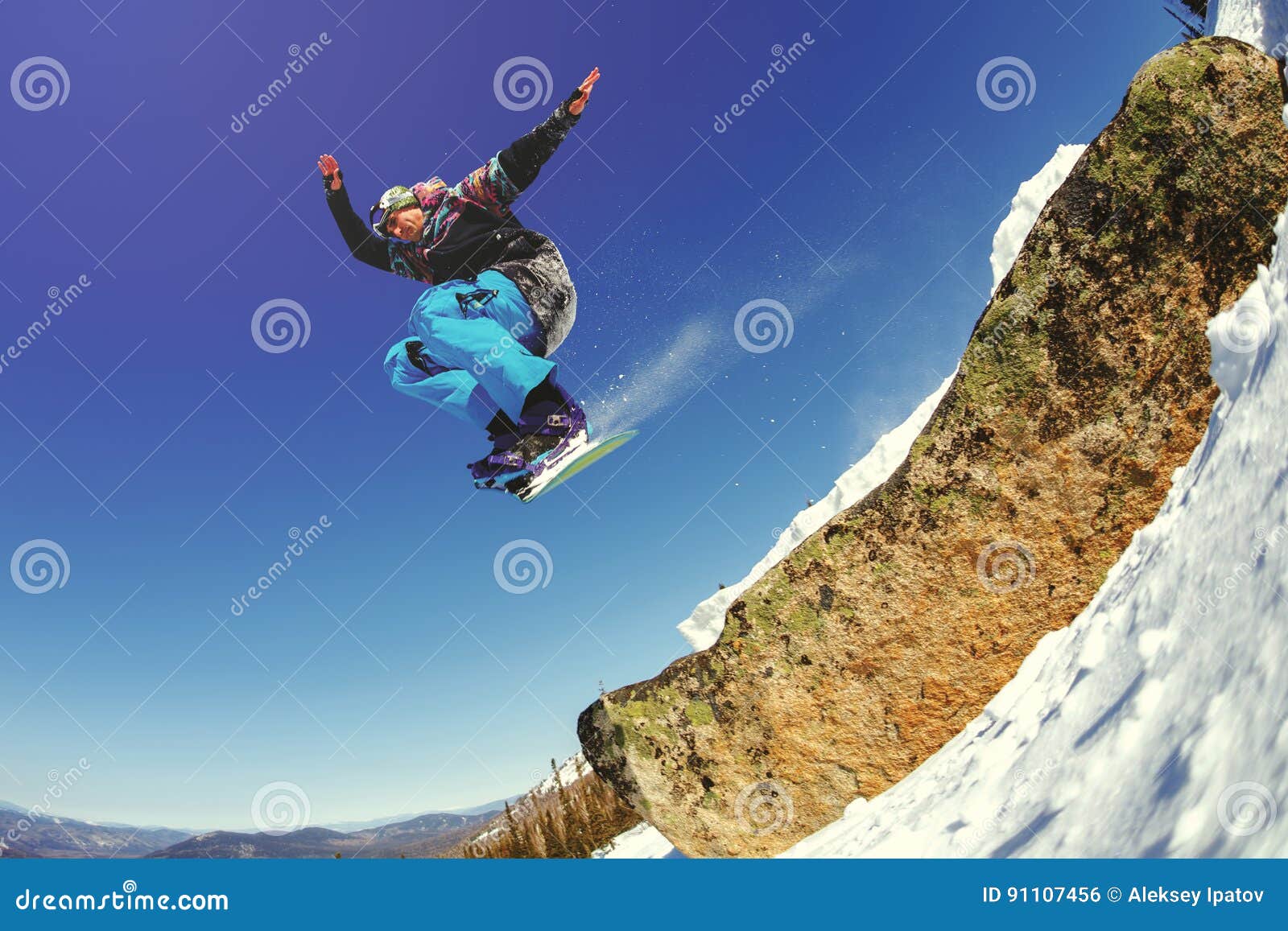 Snowboarder Jumping from the Springboard Against the Sky Stock Photo ...