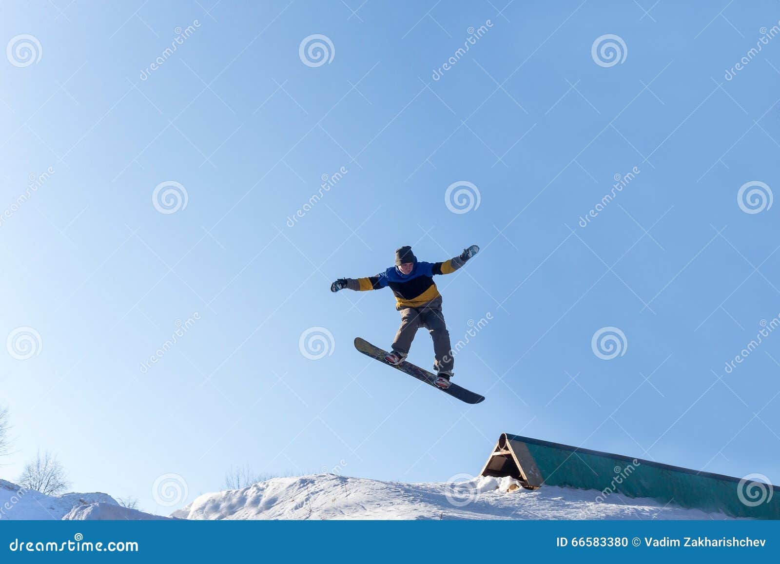 Snowboarder Jumping from a Springboard Stock Photo - Image of nature ...