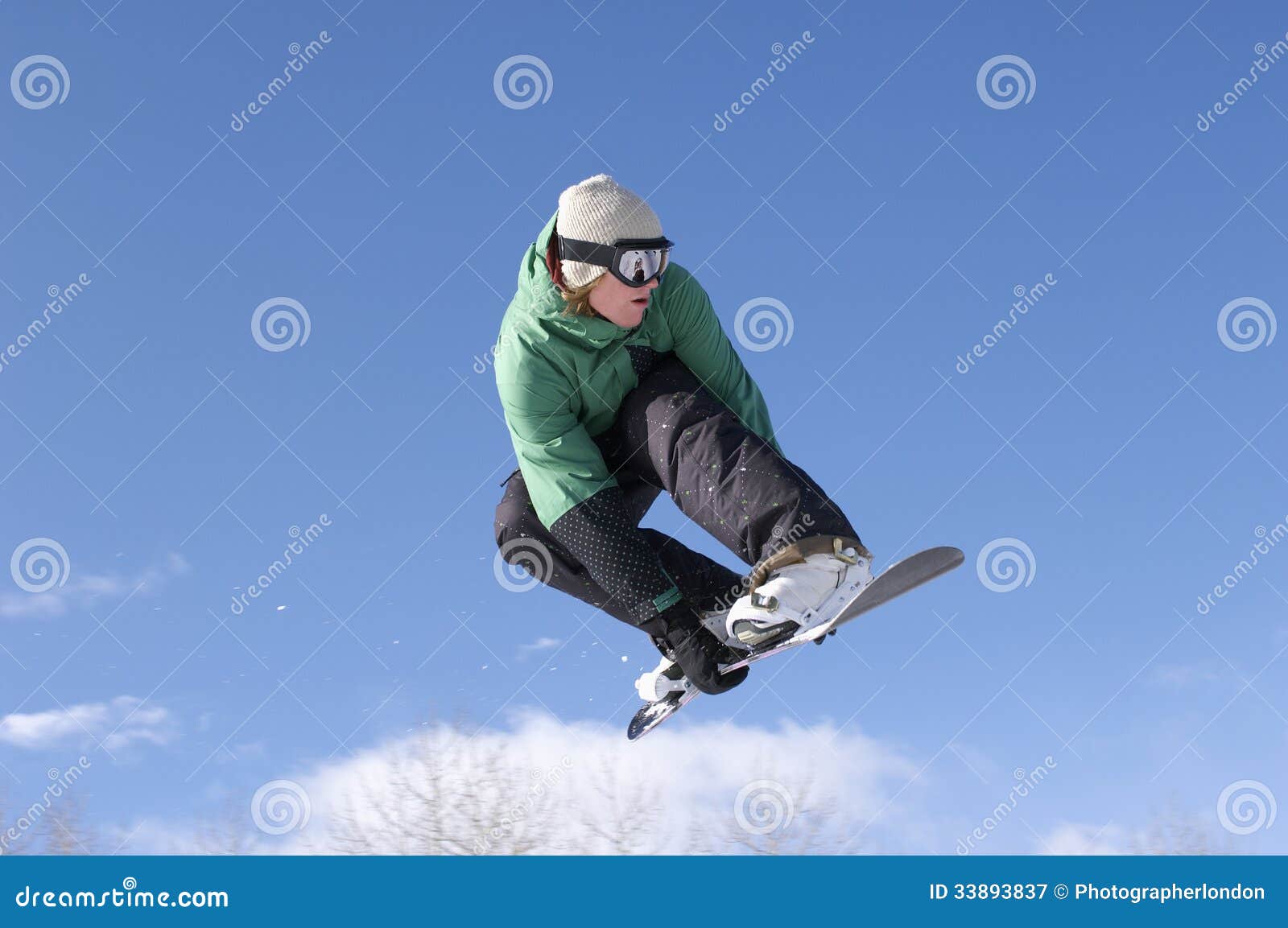 Snowboarder Performing Stunt Against Blue Sky Stock Image - Image of ...