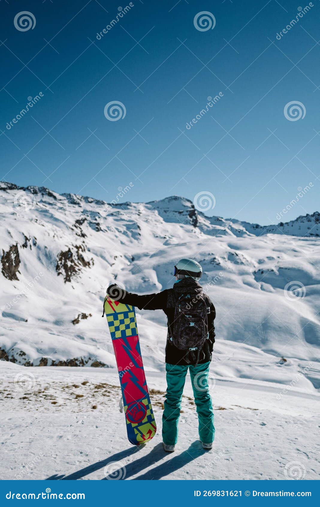 A Snowboarder Posing on Top of a Mountain with a Board Stock Image ...