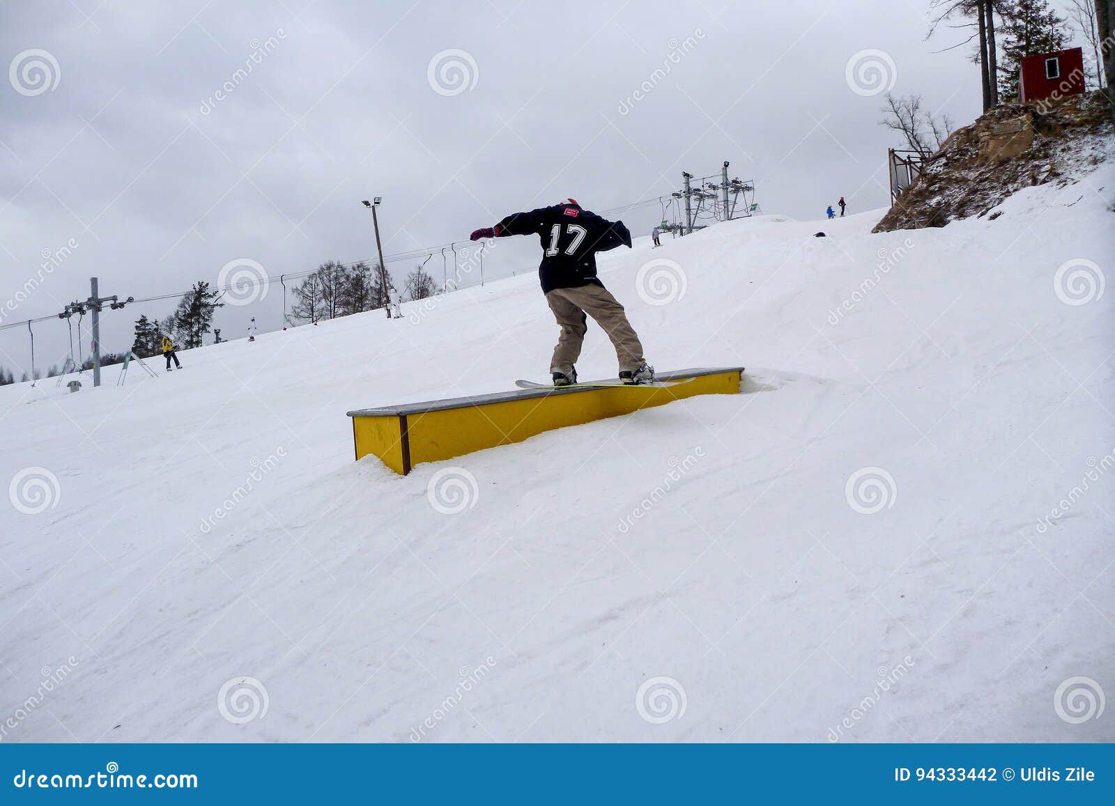 Snowboarder sliding a rail stock photo. Image of sport - 94333442