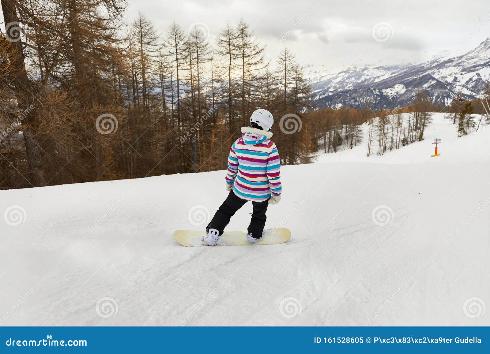 Snowboarder on the slope stock image. Image of slide - 161528605