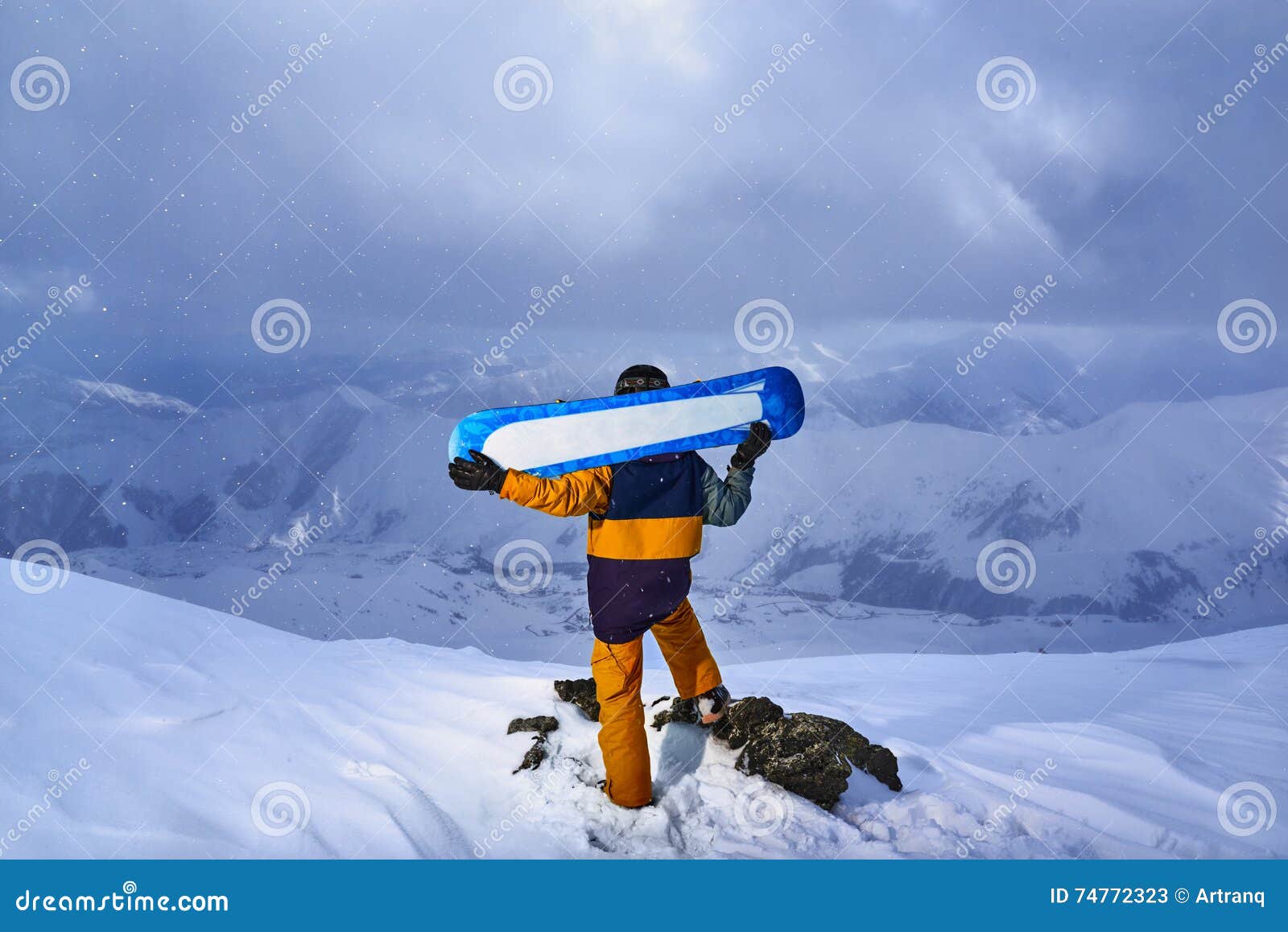 Snowboarder is Turned Back Over Cliff Snowy Weather in Mountains. Stock ...
