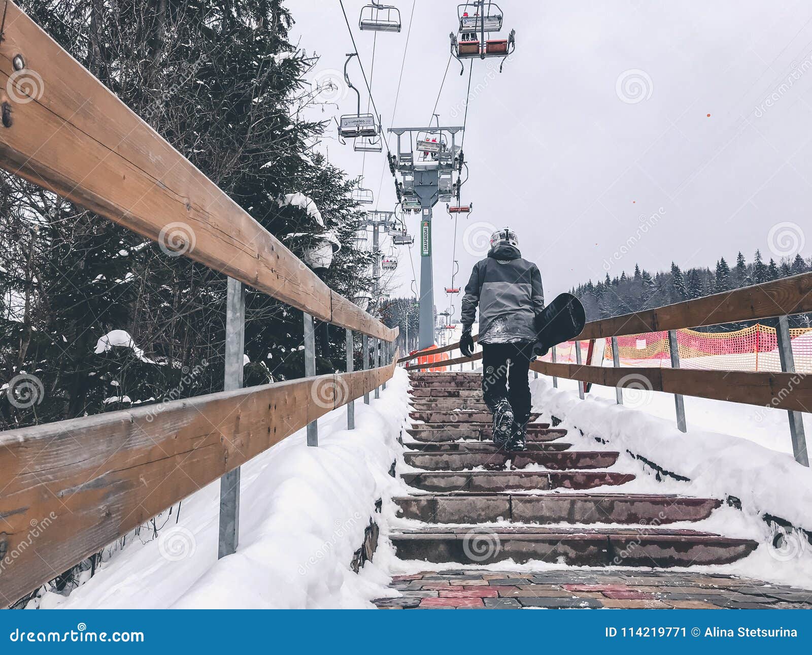 Snowboarder Walking Up the Stairs in the Ski Report. Perspective View ...