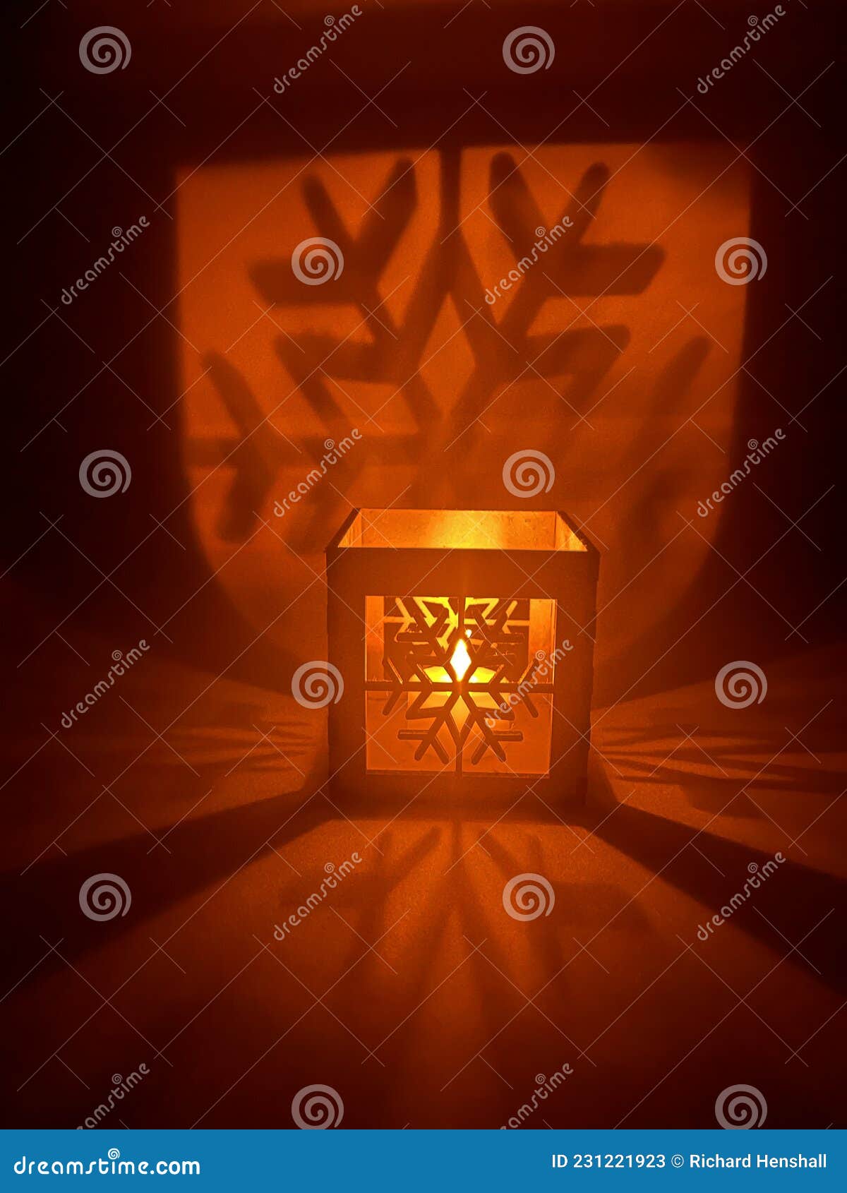 Snowflake shadow lantern stock image. Image of orange - 231221923