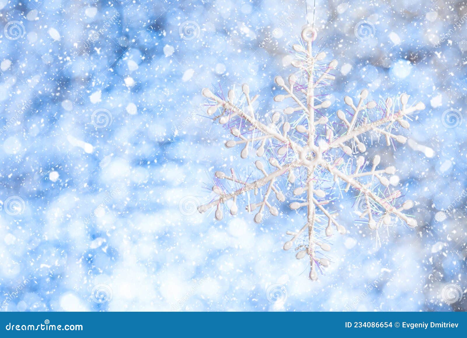 Snowflake in the Snow. White Snowflake on a Blurred Shiny White-blue ...