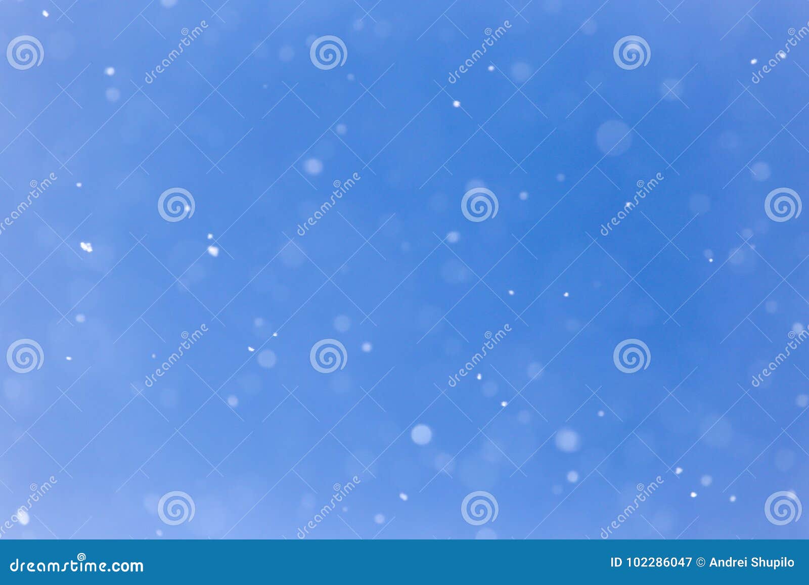 Snowing on a blue sky stock image. Image of morning - 102286047