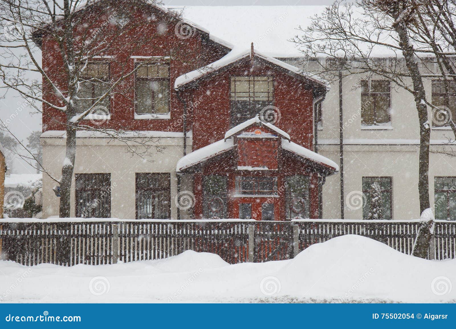 Snowing by a house stock photo. Image of attraction, december - 75502054