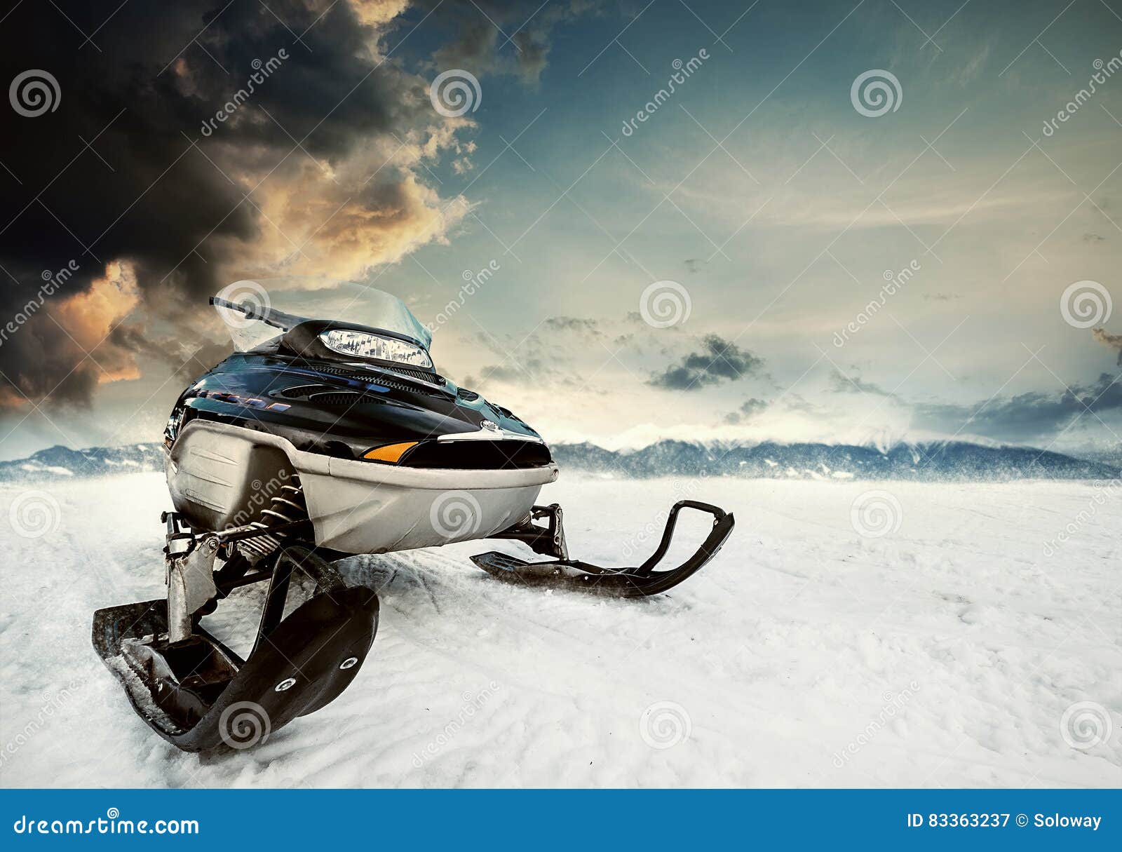 Snowmachine On The Mountain Lake Frozen Surface With Thunderstorm ...