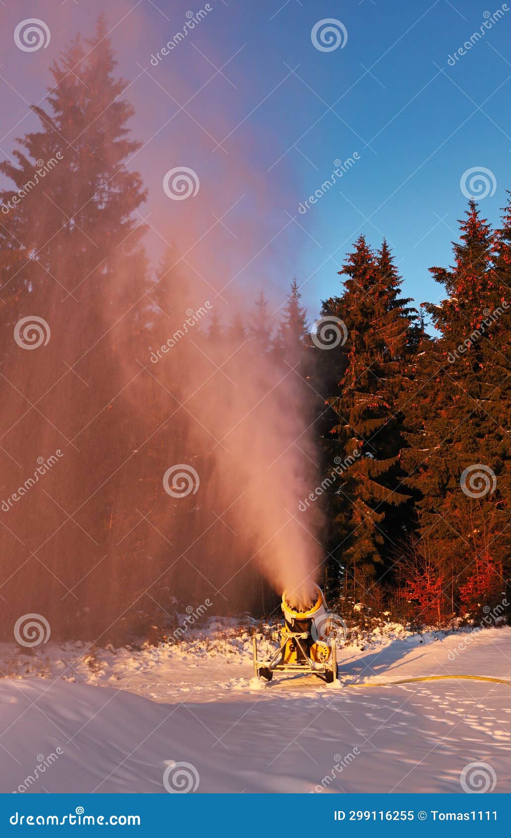 Snowmaker Producing Snow in a Ski Resort. Snowjet in Side Light and ...