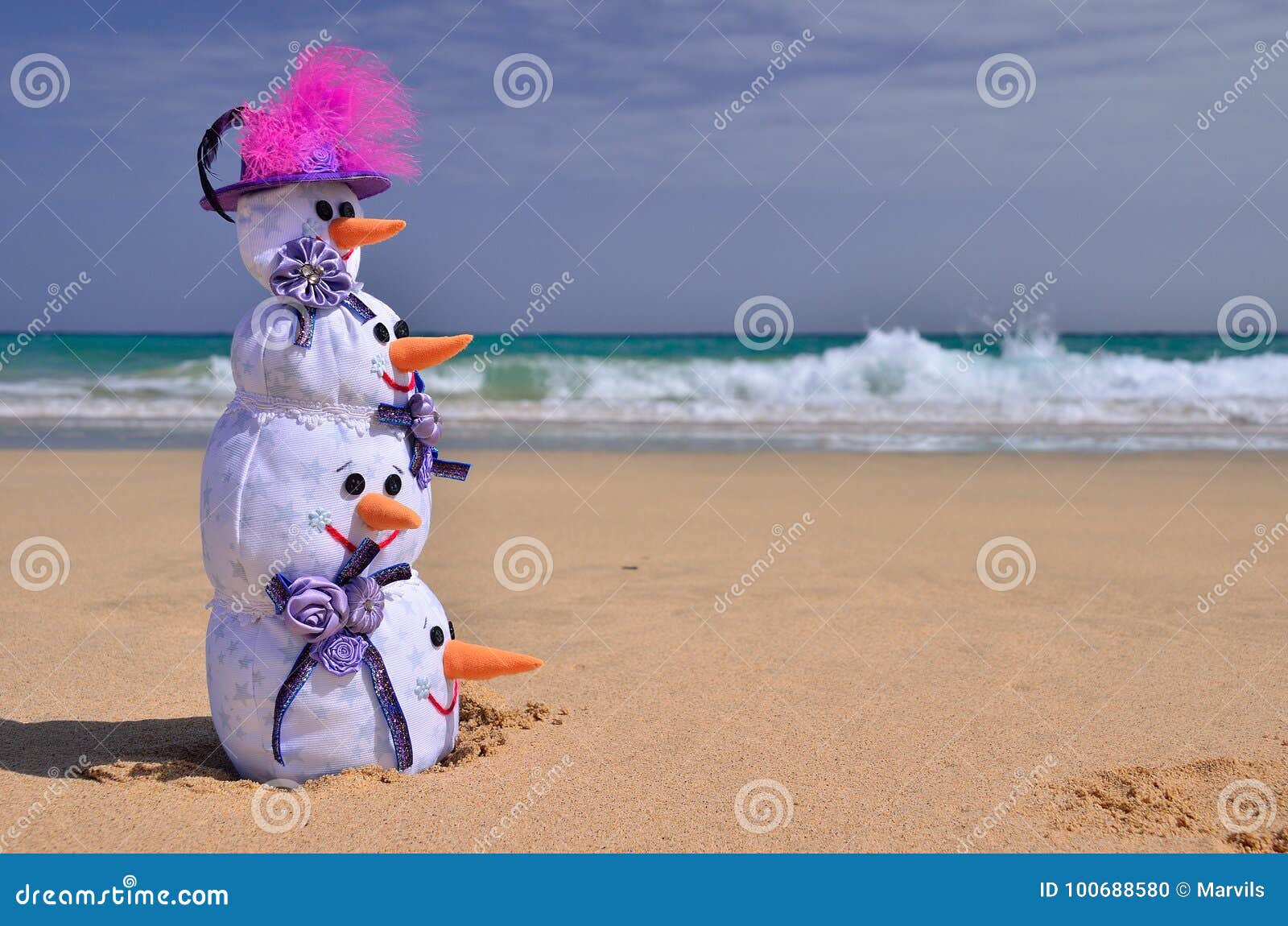 Snowman on the beach stock photo. Image of sunny, christmas - 100688580