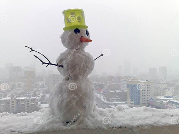 Snowman in the city stock photo. Image of winter, city - 27621770