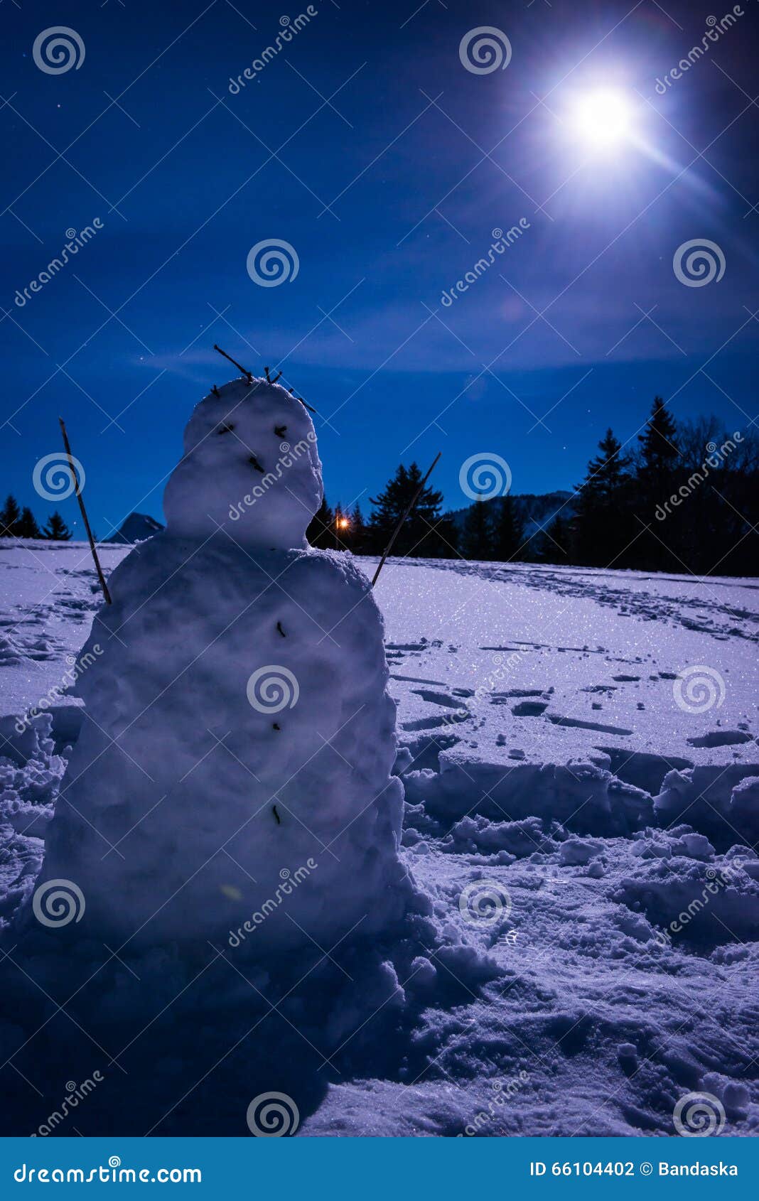 Snowman with a full moon stock photo. Image of trees - 66104402