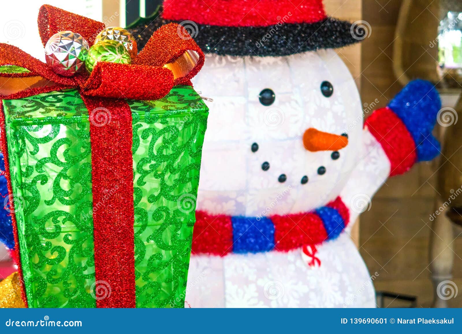 Snowman and Gift Box Decoration Stock Image - Image of evening, scarf ...