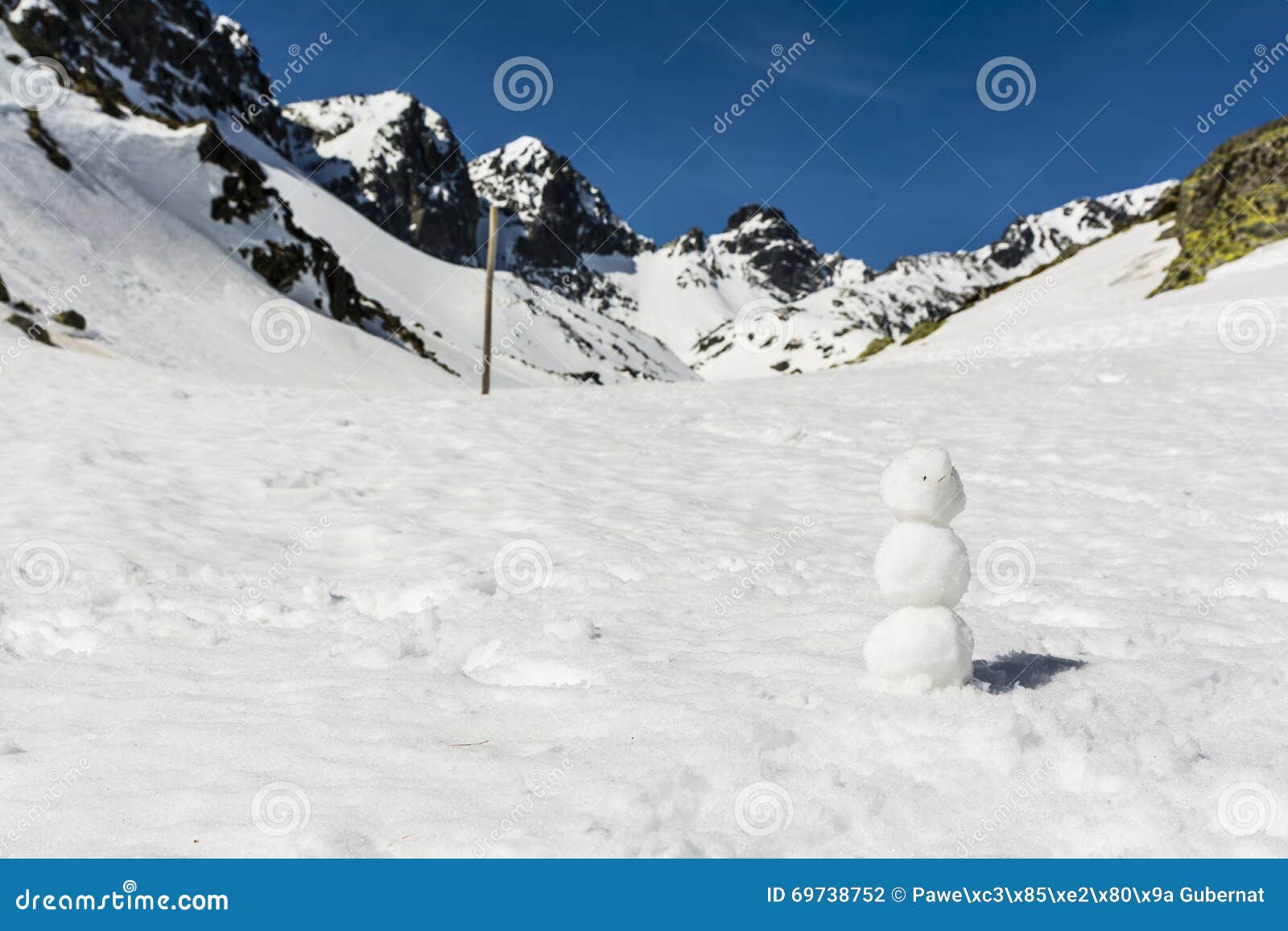 Snowman in the mountains. stock photo. Image of cold - 69738752