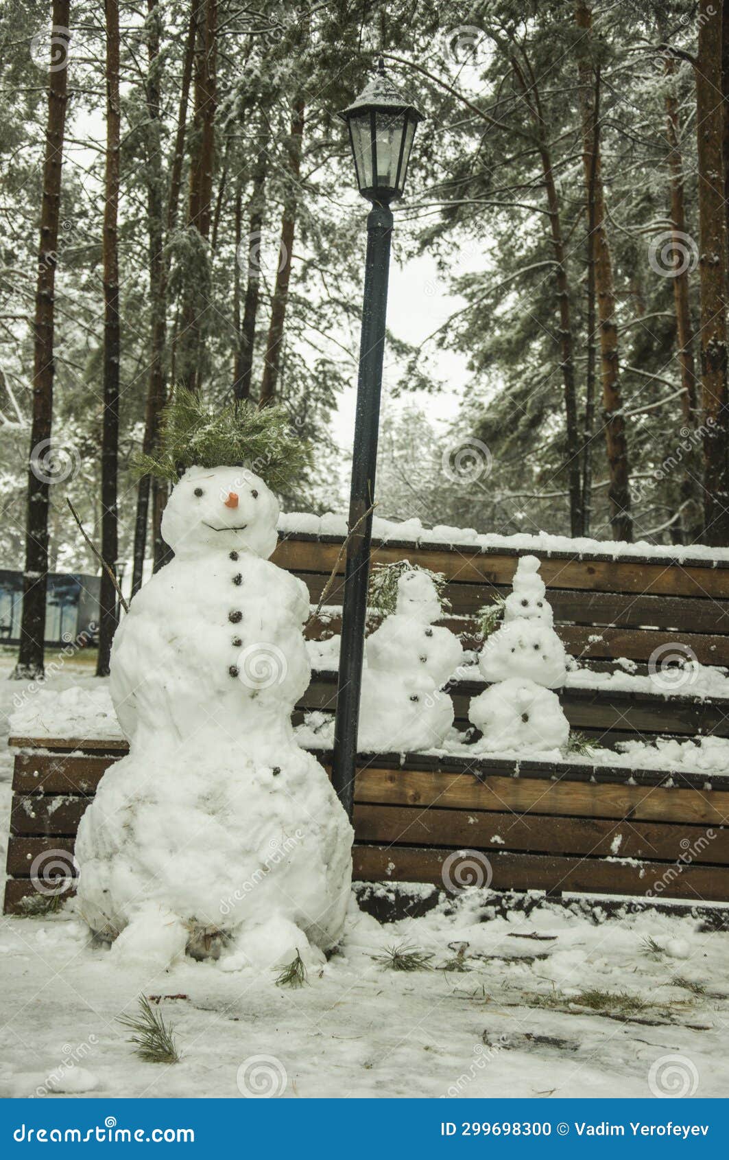 Snowman in the park stock photo. Image of snowdrift - 299698300