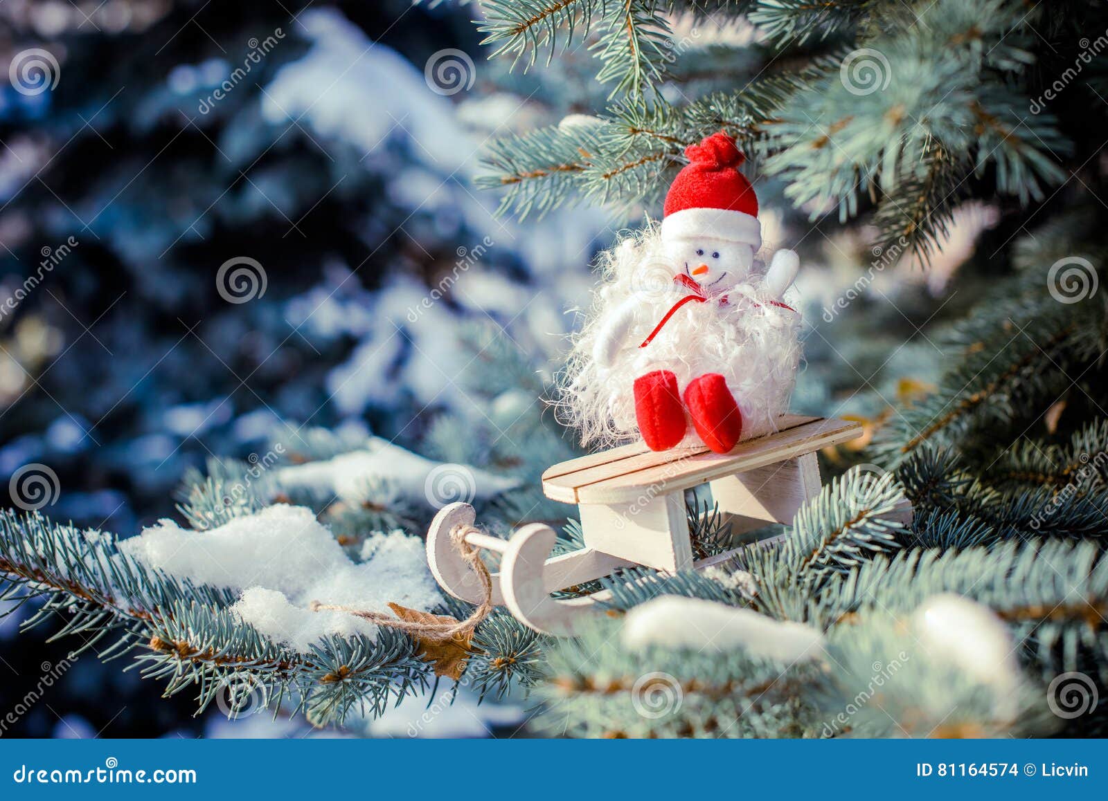 Snowman sitting on a sled stock photo. Image of color - 81164574