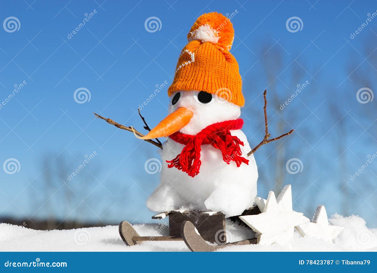 A snowman and a sled stock image. Image of outside, season - 78423787