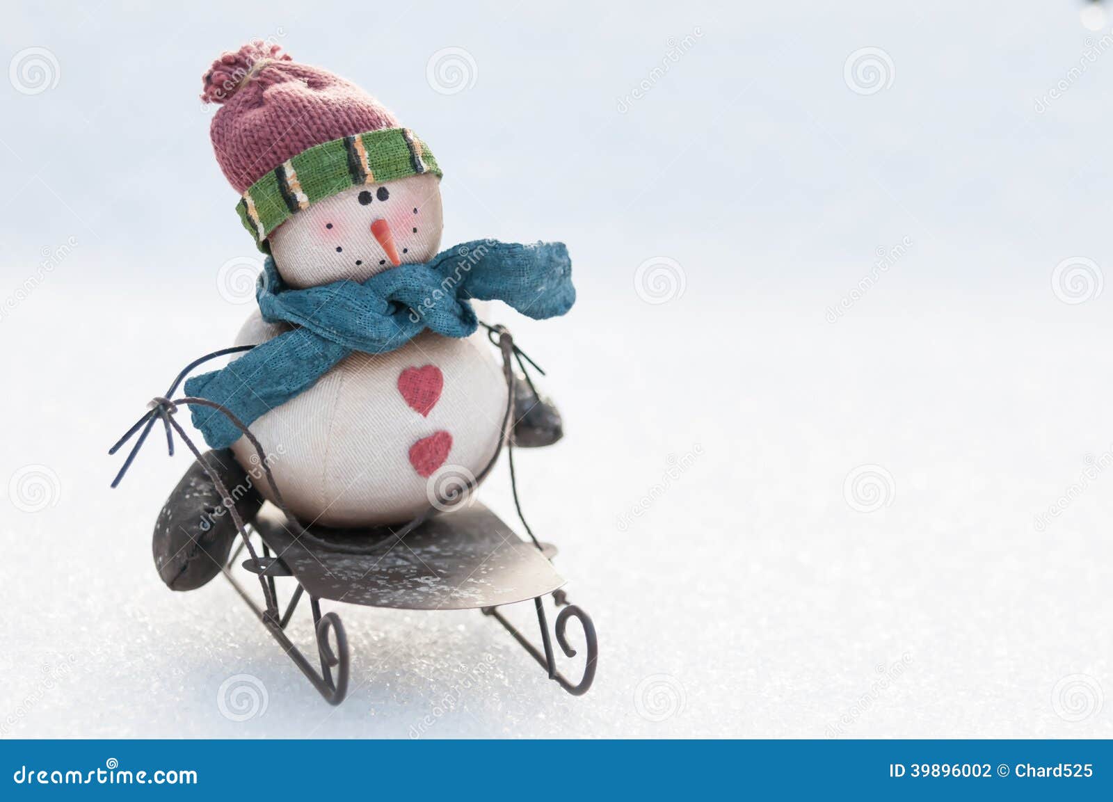 Snowman on a sled stock photo. Image of snow, cols, carrot - 39896002