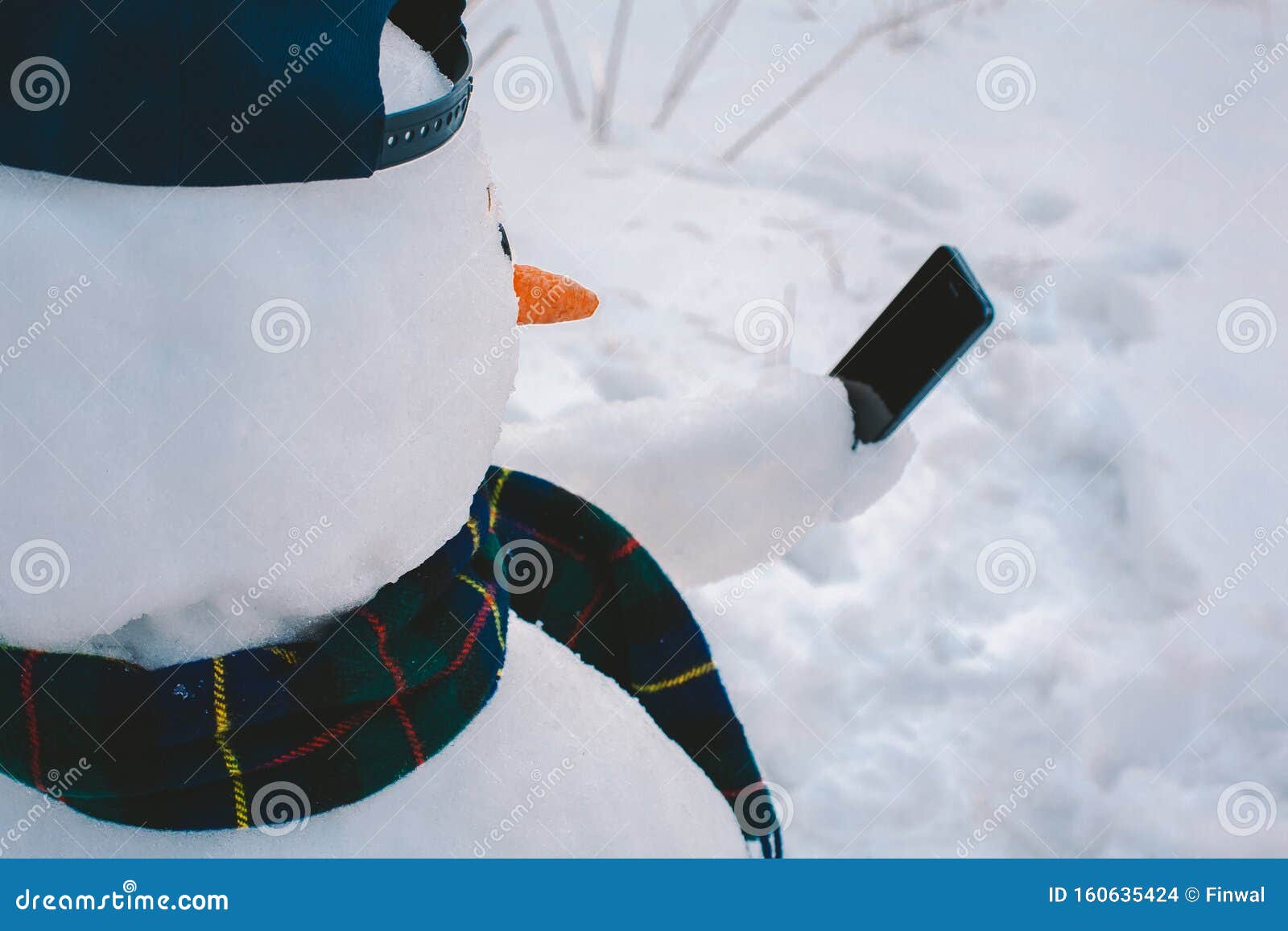 Snowman using smart phone stock photo. Image of outdoors - 160635424