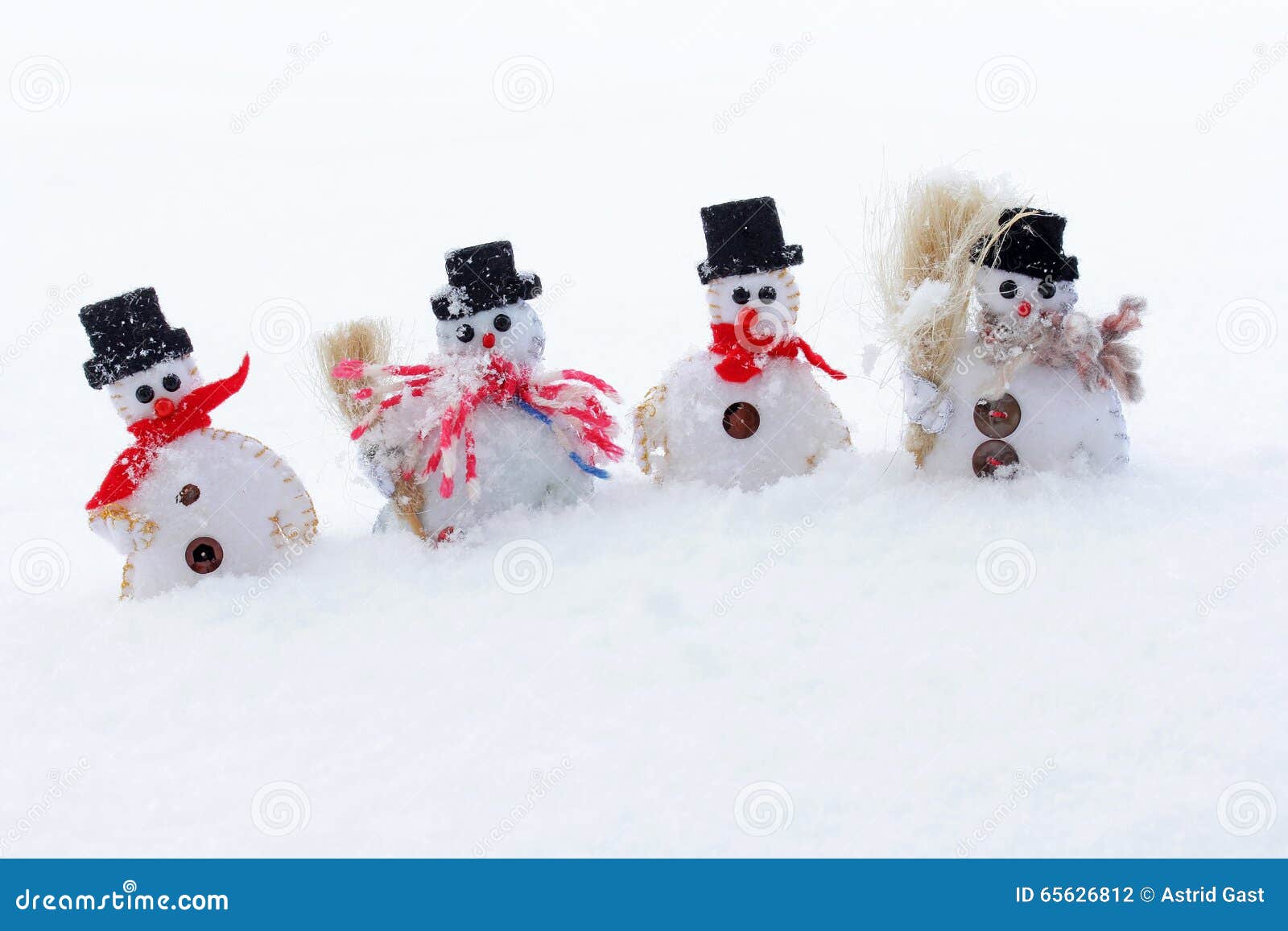 Snowmen in cold snow stock photo. Image of colorful, advent - 65626812