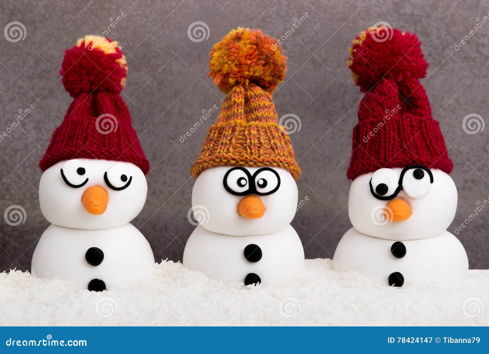 Snowmen with knitted hats stock image. Image of christmas - 78424147