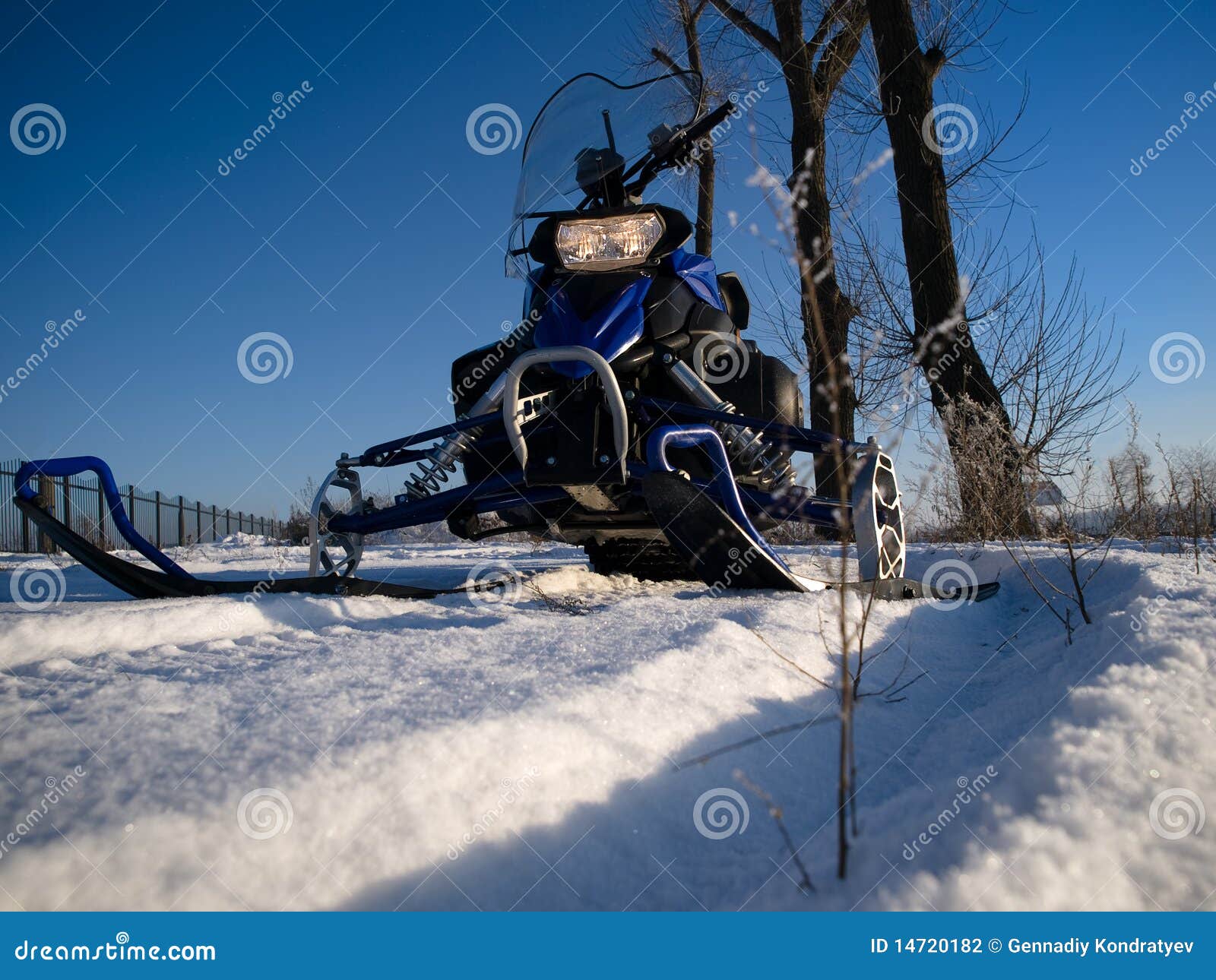 Snowmobile and blue sky stock photo. Image of motorsledge - 14720182