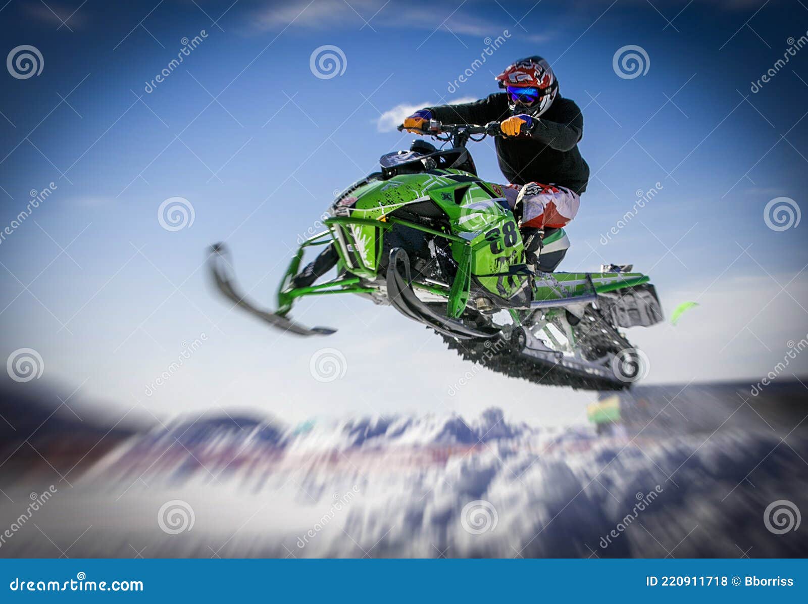 The Snowmobile Rider Jumping through Snow. Close Up Stock Photo - Image ...