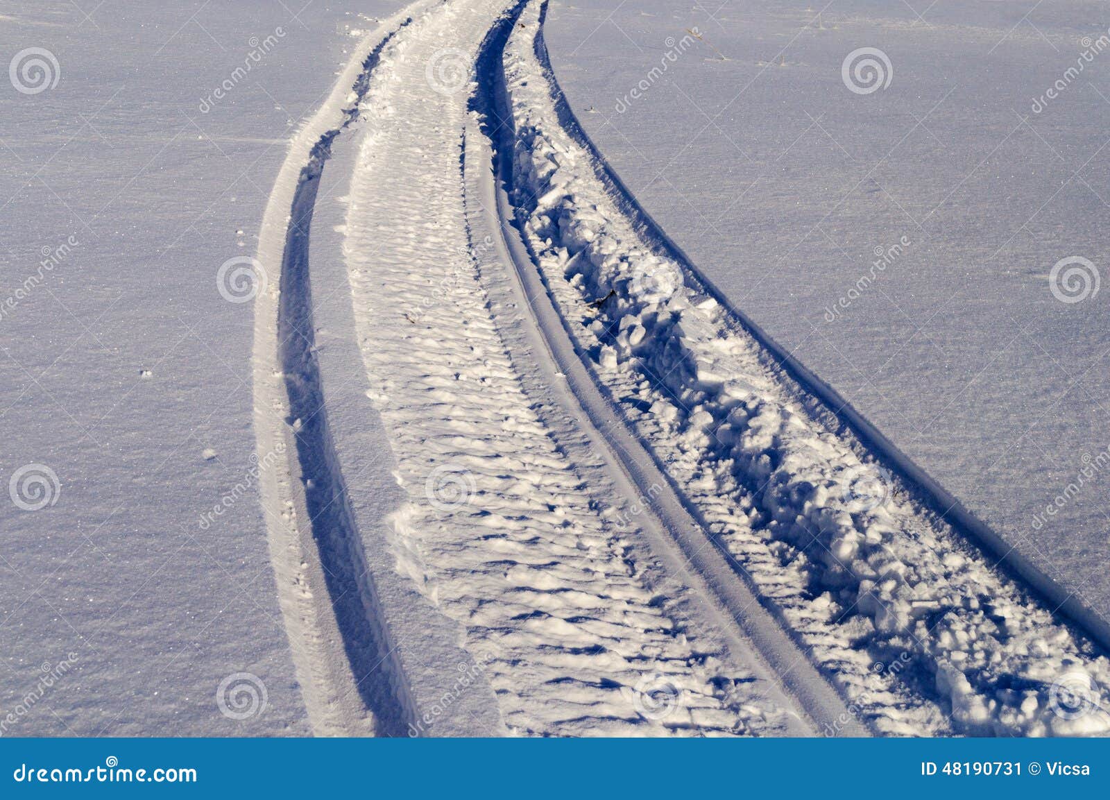 Snowmobile track in snow stock image. Image of color - 48190731