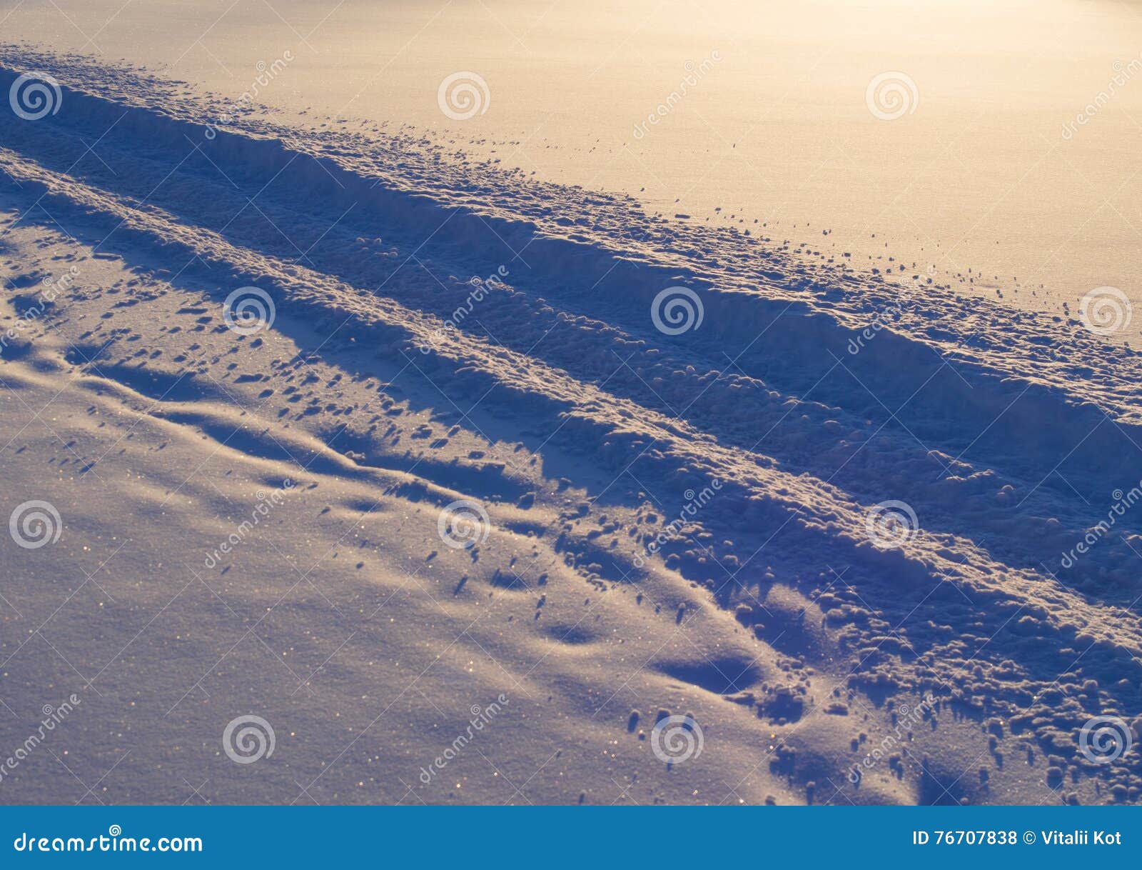 Snowmobile tracks in snow stock photo. Image of nature - 76707838